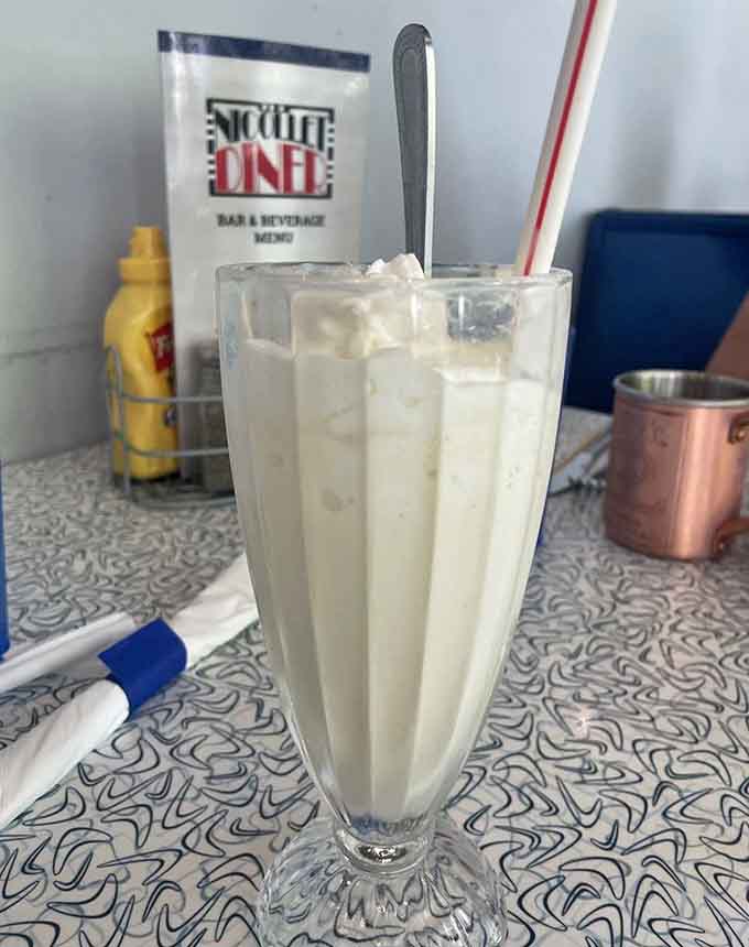 Behold the milkshake that launched a thousand return visits, tall and frosty in its classic glass.