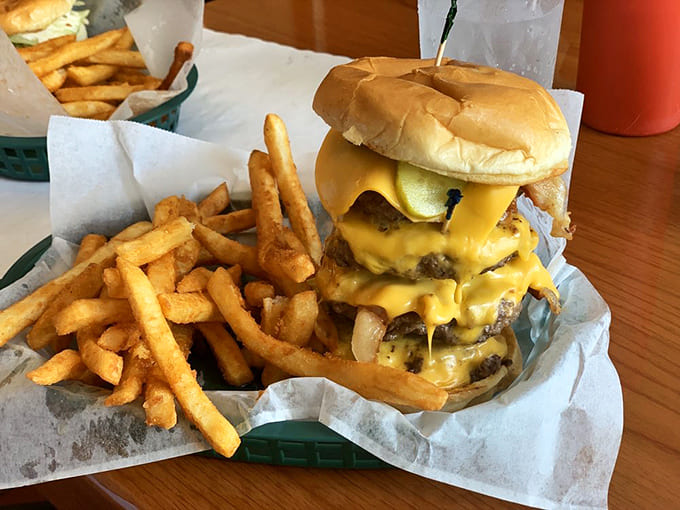 The legendary burger in all its glory &ndash; a towering masterpiece where molten cheese cascades over perfectly seasoned beef and crispy bacon.