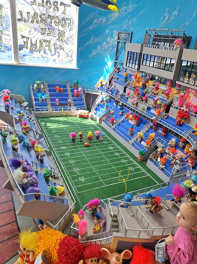 Tiny spectators with technicolor hair fill the bleachers of this meticulously crafted troll football stadium &ndash; the Super Bowl as imagined by someone with a delightful obsession.