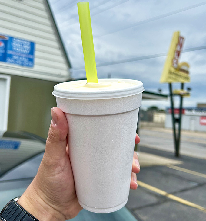 A classic shake awaits its lucky recipient, the sturdy straw standing at attention in thick, creamy goodness.