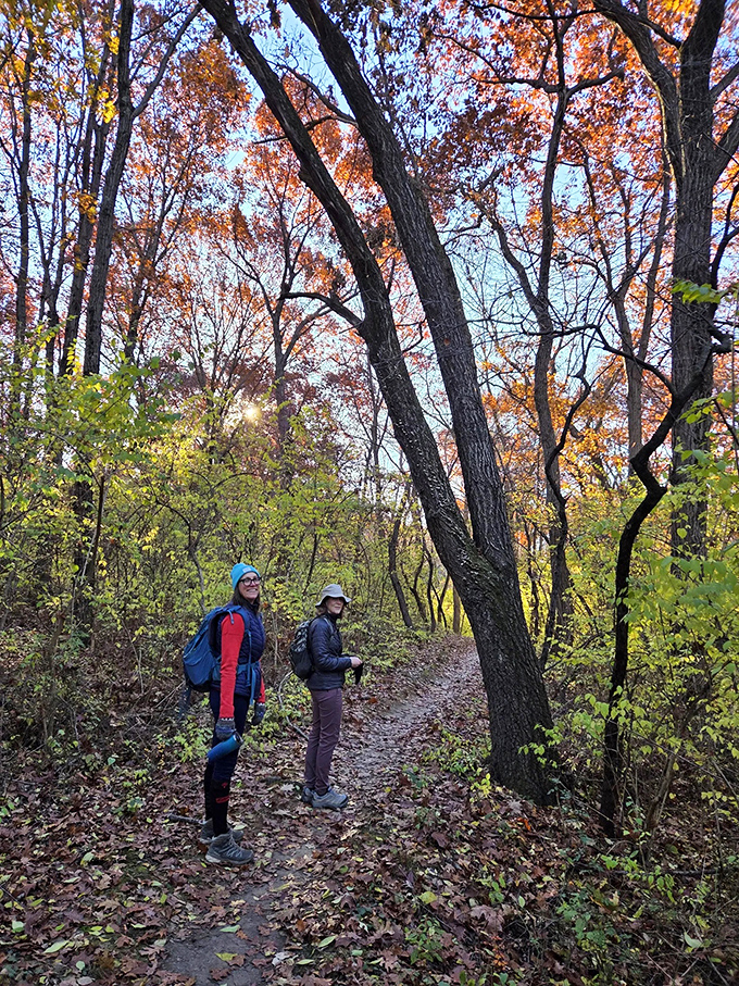 Trail enthusiasts pause at intersection 19, consulting the map for their next adventure. Getting "lost" here is half the fun!