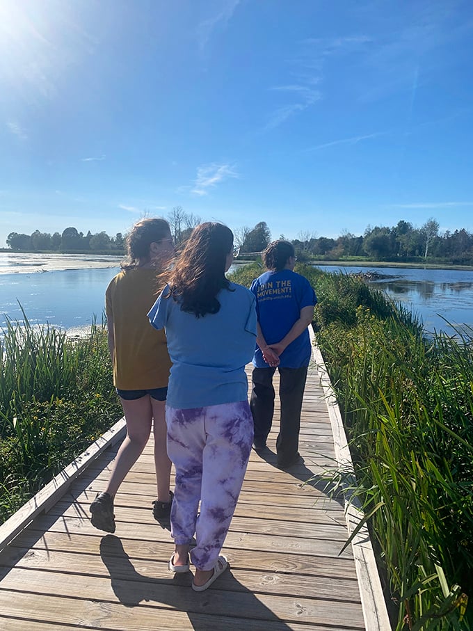 Fellow explorers soak in the serenity of Arcadia Marsh &ndash; some moments are better shared than solo.