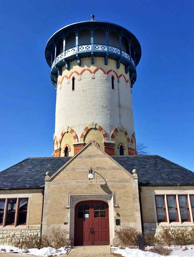 The Water Tower's distinctive silhouette has become Riverside's iconic landmark, standing tall against the brilliant blue Illinois sky.