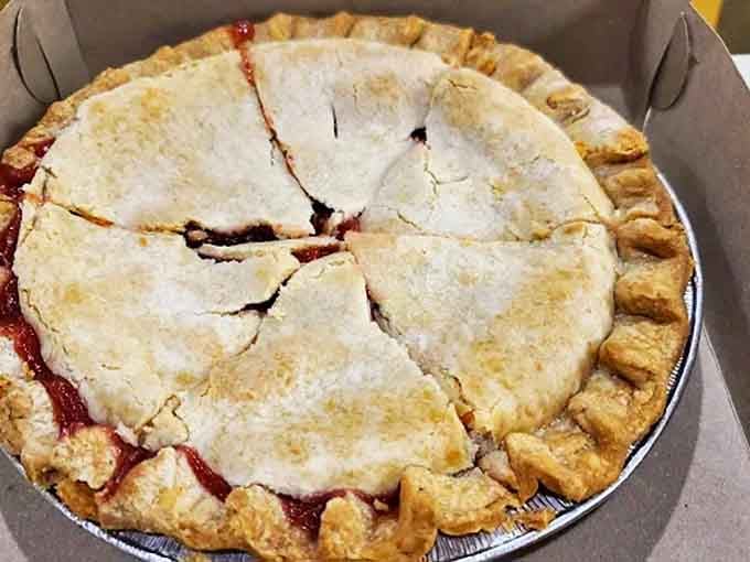 A whole cherry pie awaits its destiny &ndash; that perfectly crimped crust hiding a sweet-tart filling that's been perfected over decades.
