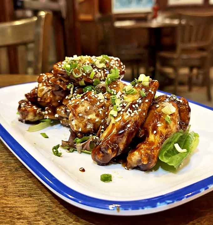 These aren't just wings &ndash; they're a sticky, sweet-spicy masterpiece that proves British pubs can do American bar food with surprising flair.