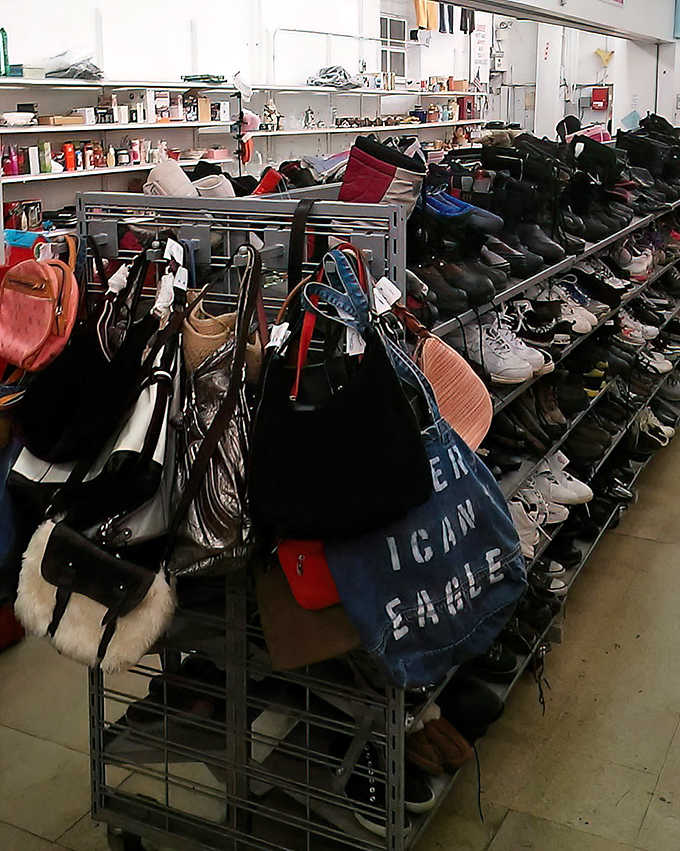 The accessories section: where designer bags and practical footwear live together in perfect harmony, waiting for their next adventure.