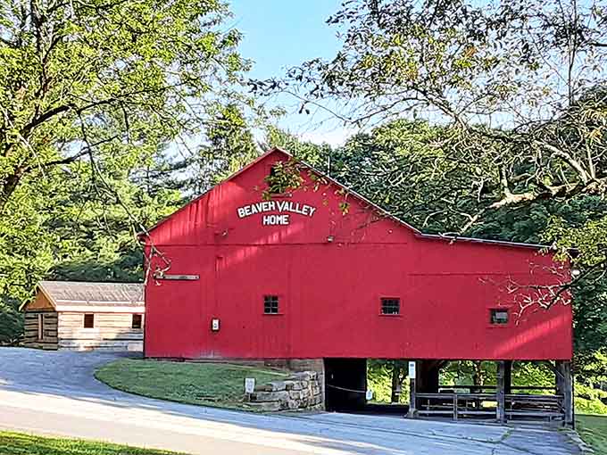 The vibrant red Beaver Valley Home barn pops against the green landscape like a cardinal in winter, its classic design a nod to Ohio's agricultural heritage.