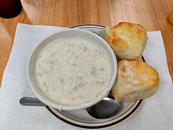 These biscuits and gravy aren't just a dish &ndash; they're an experience. Fluffy clouds of dough swimming in peppery, sausage-studded heaven.