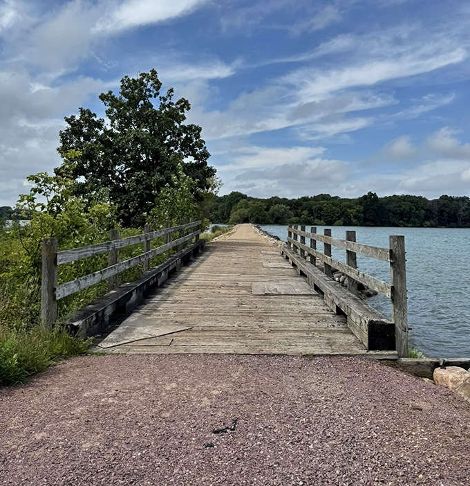 The weathered wooden bridge tells stories of countless crossings, each plank a chapter in Lake Shetek's ongoing tale.
