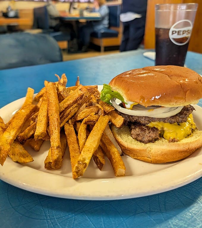 This isn't just any cheeseburger &ndash; it's a hand-formed masterpiece with golden fries that puts fast food imposters to shame.