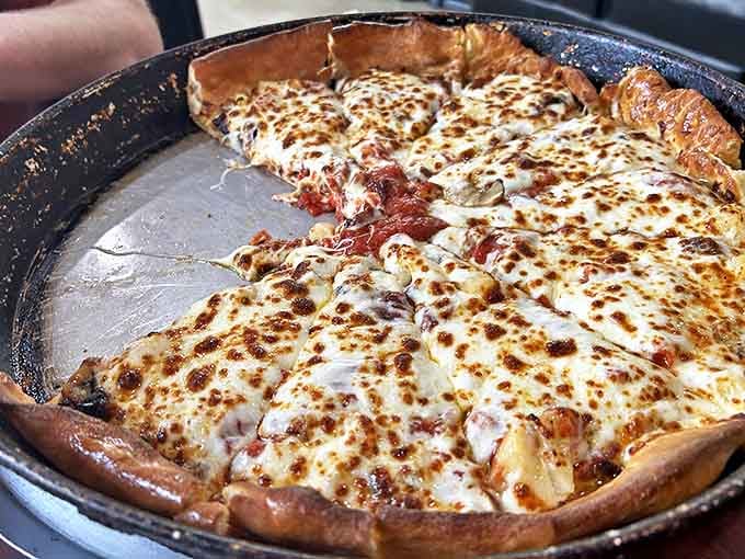 Chicago-style pizza: Deep dish divinity! This architectural marvel of cheese, sauce, and buttery crust would make any Chicagoan nod in respectful approval.