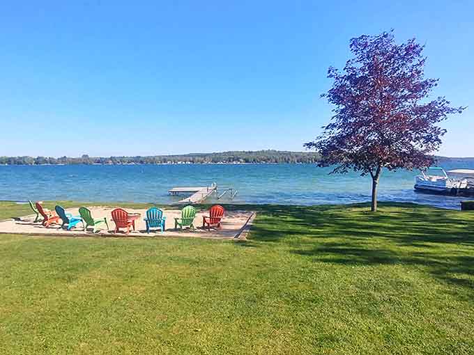 Lakeside living: Colorful Adirondack chairs await storytellers and sunset-watchers, forming the perfect front-row seats to nature's daily performance.