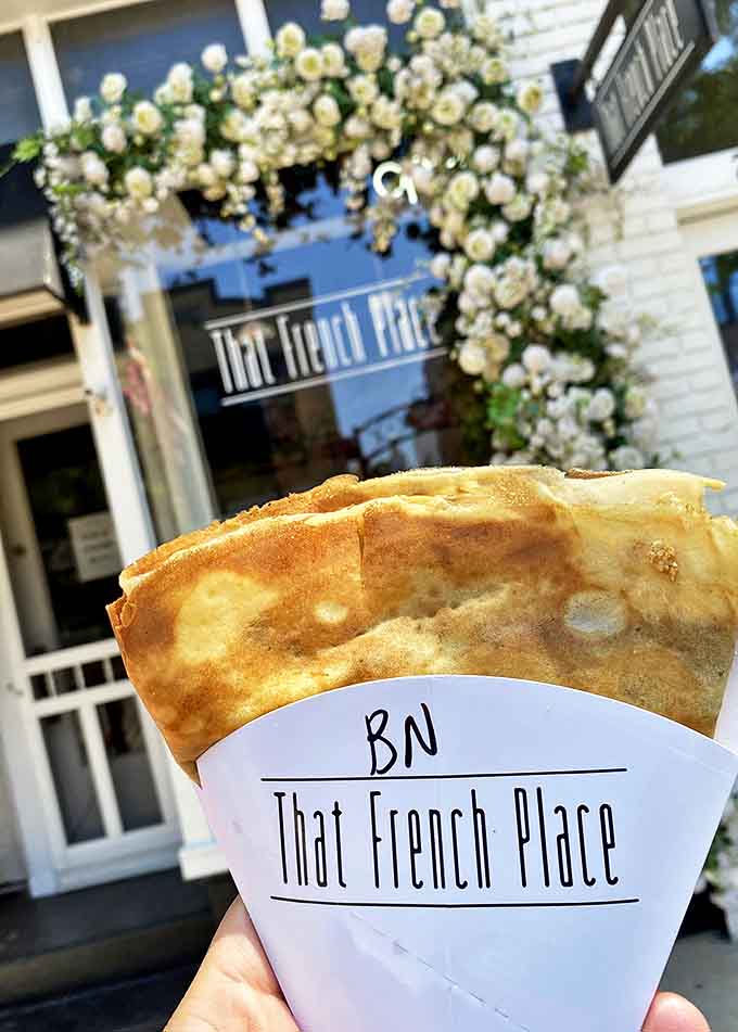 This isn't just any crepe &ndash; it's a handheld miracle of thin, buttery perfection wrapped in paper, ready for your first blissful bite.