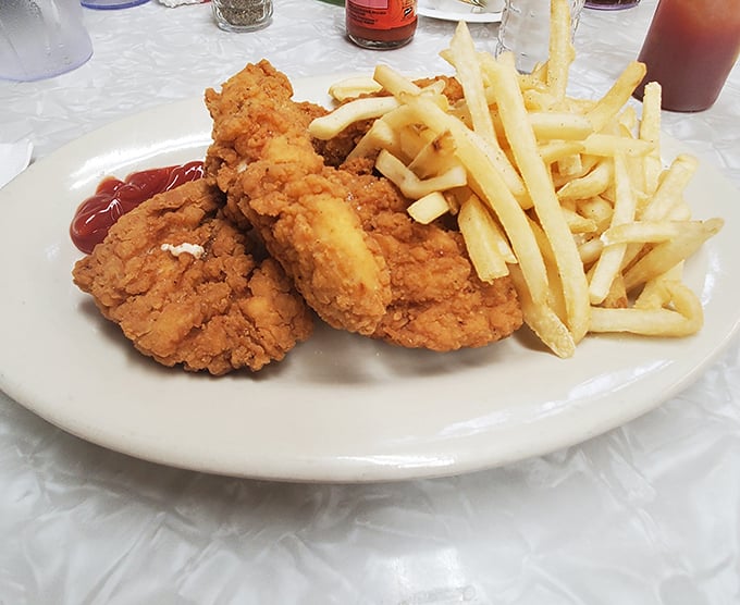 Golden-brown perfection on a plate &ndash; the legendary fried chicken arrives with crispy fries, a combination that's converted countless first-time visitors into regulars.