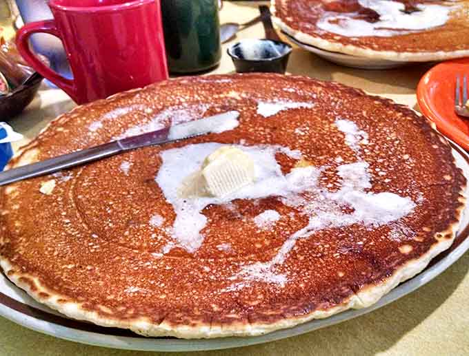 Golden-brown perfection that extends beyond its plate, this pancake doesn't just feed you&mdash;it challenges you to a delicious duel.