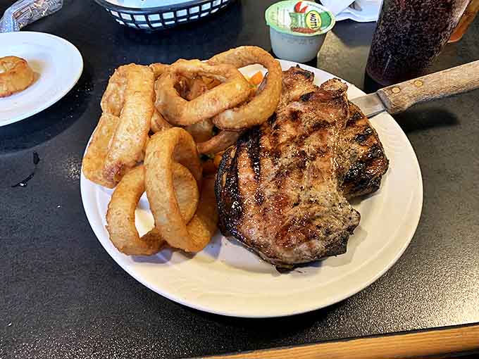 This grilled pork chop isn't just dinner &ndash; it's a masterclass in meat preparation, with those perfect grill marks deserving their own trophy ceremony.
