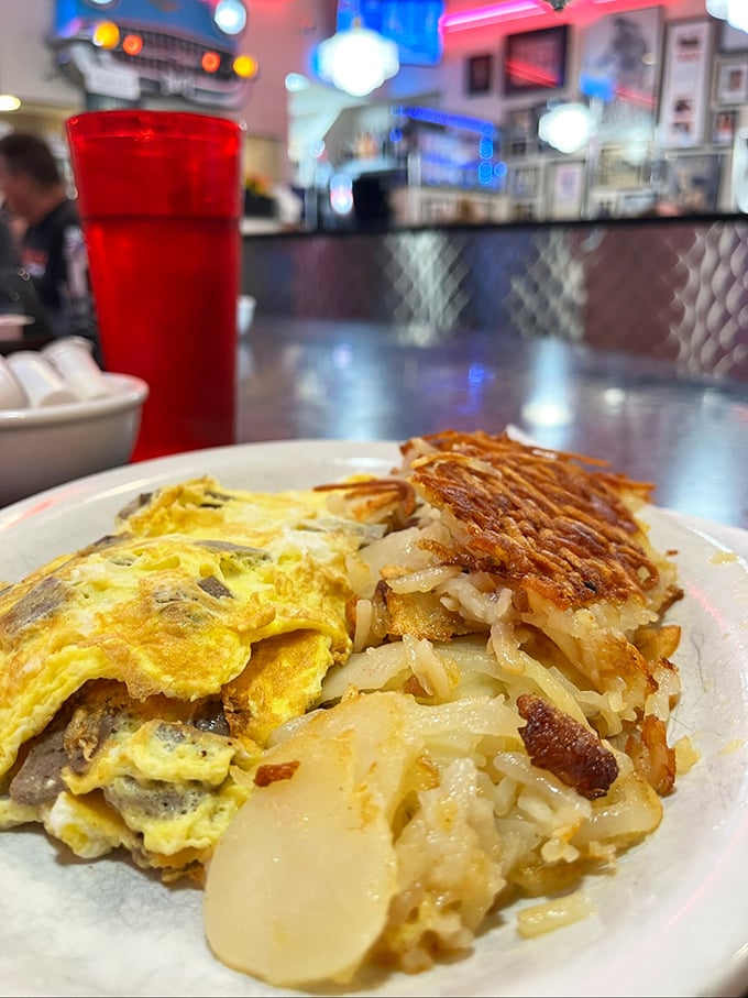 This isn't just any omelet &ndash; it's a masterpiece of fluffy eggs cradling savory gyro meat, with hash browns crisped to golden perfection.