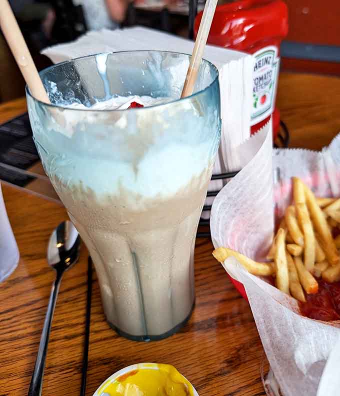 This isn't just a strawberry milkshake &ndash; it's a ruby-swirled masterpiece that requires both spoon and straw, demanding respect with every luscious, berry-flecked spoonful.
