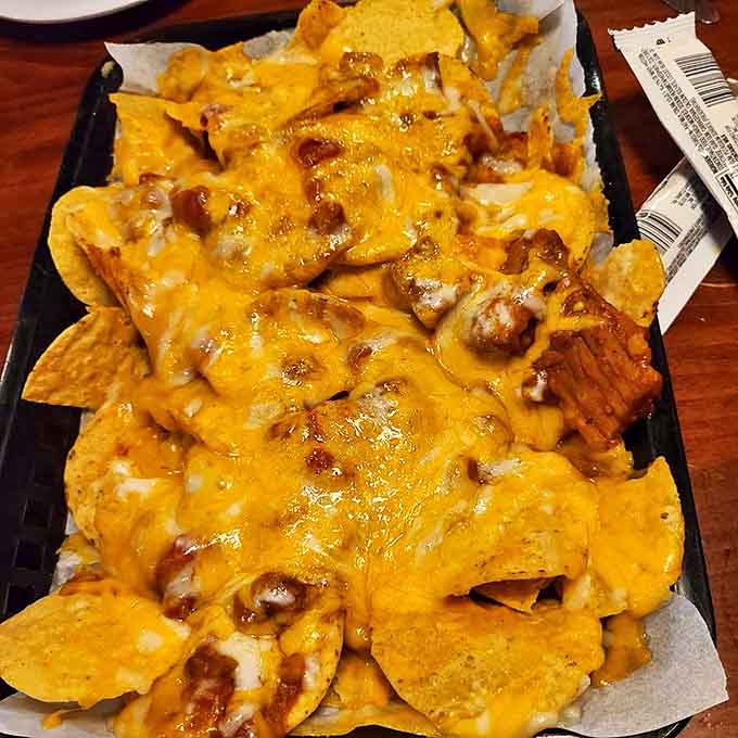 Loaded nachos that require a structural engineer's approval &ndash; layers of tortilla chips supporting mountains of meat, cheese, and pure joy.
