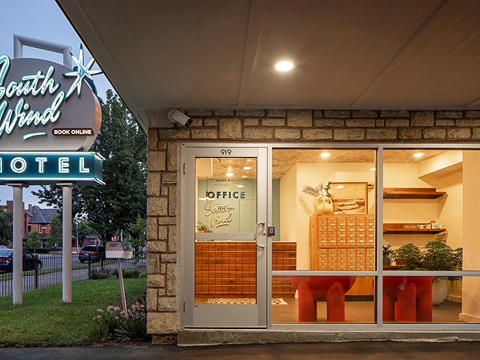 The lobby welcomes guests with warm wood tones and those charming key cubbies that defined motels of yesteryear.