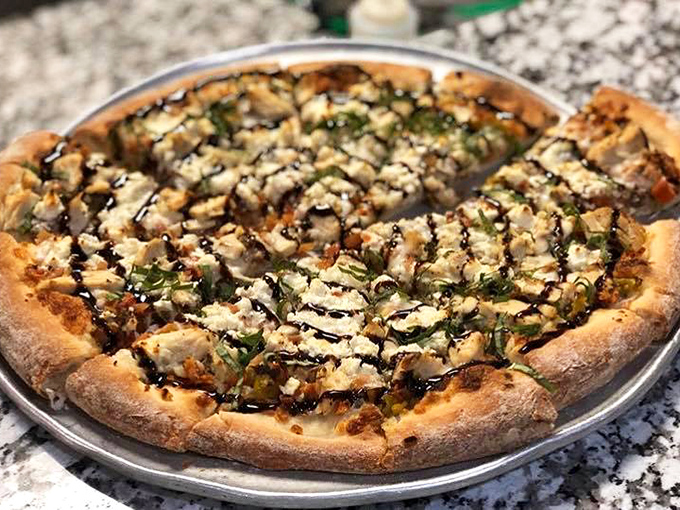 This isn't just pizza &ndash; it's an edible canvas where fresh herbs dance across melted cheese in a delicious composition.
