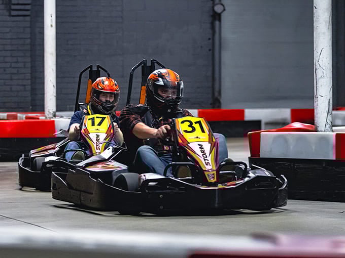 Two racers navigate a tight corner, that familiar look of concentration that says "I'm definitely beating you to dinner tonight."
