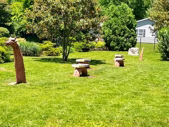 Not your average playground equipment! This segmented dragon sculpture emerges from the earth with fierce eyes and impressive detail.