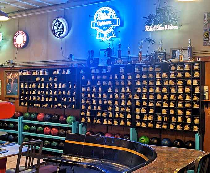 Rows of well-loved bowling shoes stand ready for their next adventure, each pair holding secrets of strikes and gutter balls past.