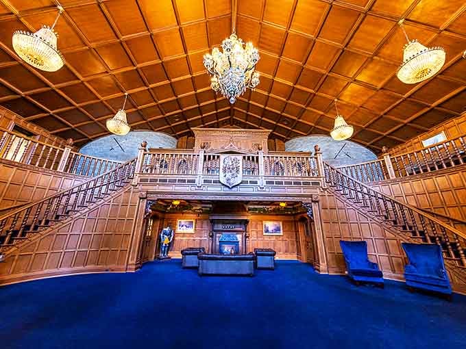 Elegant staircases lead to the second-floor gallery, where visitors can gaze down upon the great hall like nobles surveying their medieval domain.