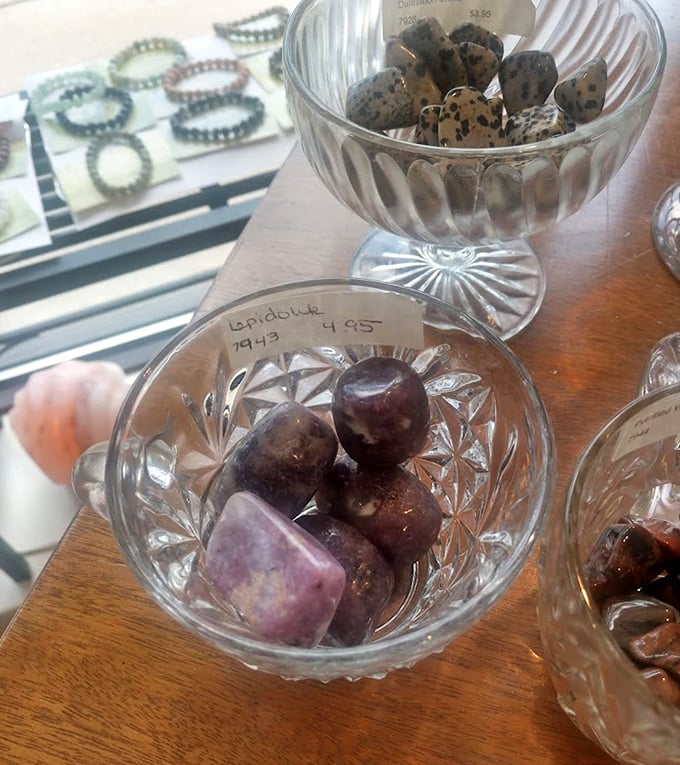 Display of healing stones and minerals: A treasure trove of earth's glowing gifts, each promising different healing properties. Window shopping for your chakras!
