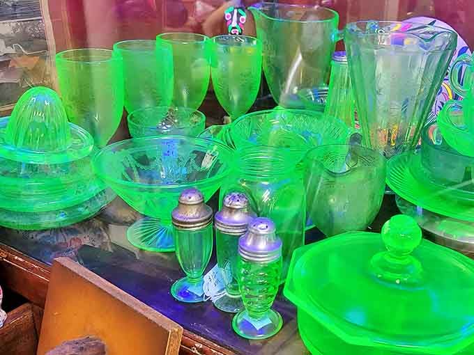Uranium glass collection glowing with eerie beauty &ndash; the perfect centerpiece for dinner parties where you want subtle radioactive chic.