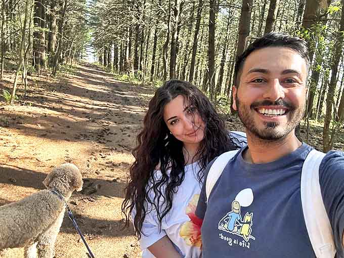 Hikers enjoying the trail's peaceful solitude, where conversations flow as naturally as the river below and cell service thankfully doesn't.