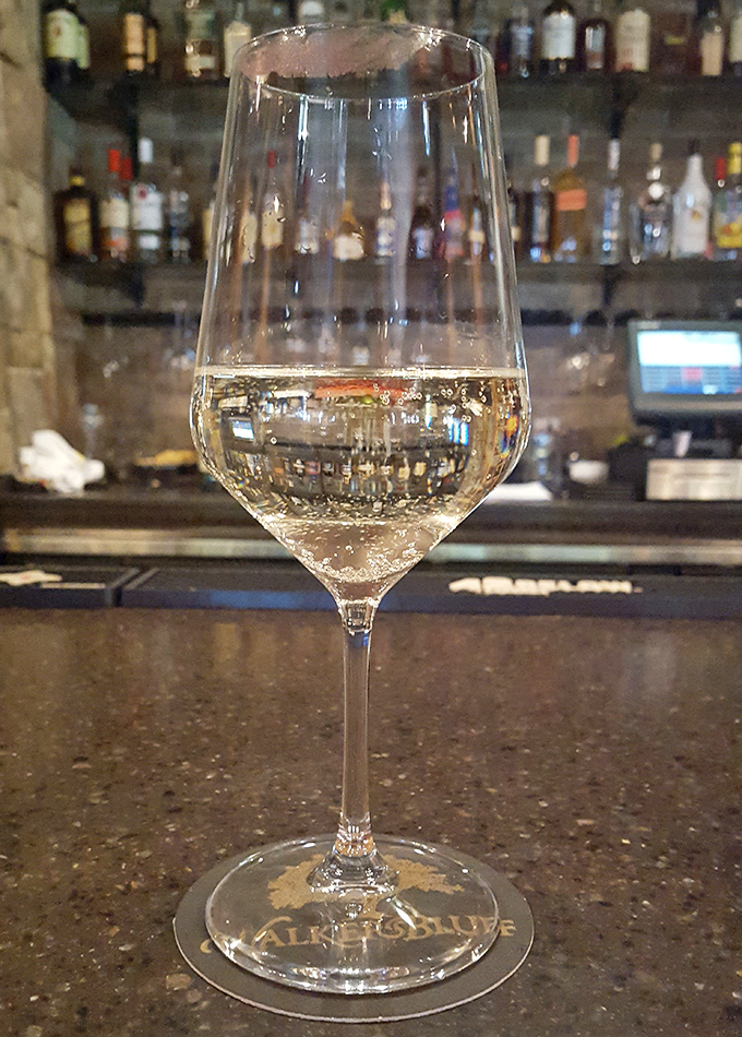 Crystal clear and catching the light just right &ndash; a glass of Walker's Bluff white wine promises refreshment with Midwestern character.