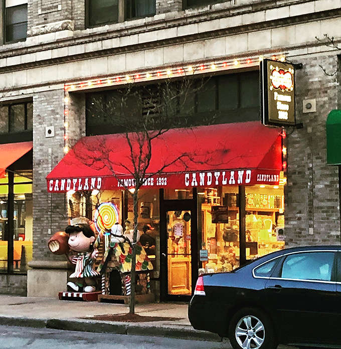 The classic storefront of the Original Candyland proudly announces its sweet heritage with "Famous Since 1932" emblazoned across its cheerful red awning.