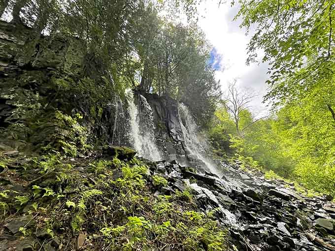 The misty spray from Bridal Veil Falls creates a cool, refreshing atmosphere that feels like nature's air conditioning on warm days.