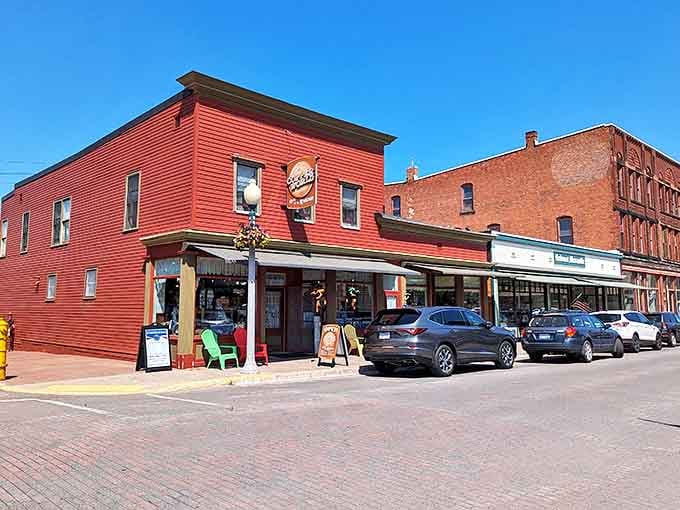 The bright red storefront stands out against Calumet's brick buildings, inviting visitors to step inside and discover treasures in this historic mining town.