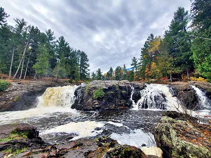 The forest parts to reveal this spectacular cascade, where sunlight plays through the mist like nature's own light show.