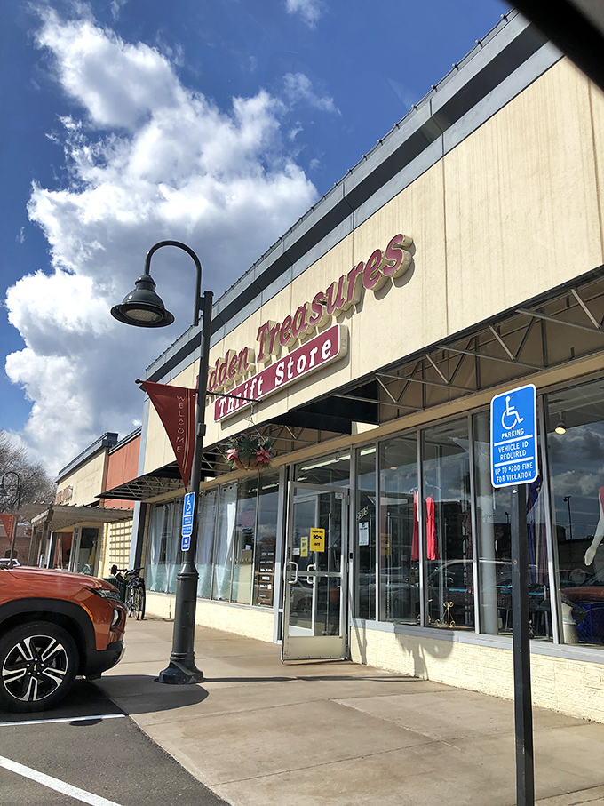 Sunshine bathes the welcoming entrance of Hidden Treasures, where everyday bargains await under bright blue Minnesota skies.