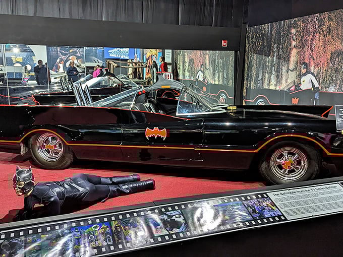 Holy automotive history, Batman! The original 1960s Batmobile gleams with midnight-black perfection, ready to fight cartoon crime in style.
