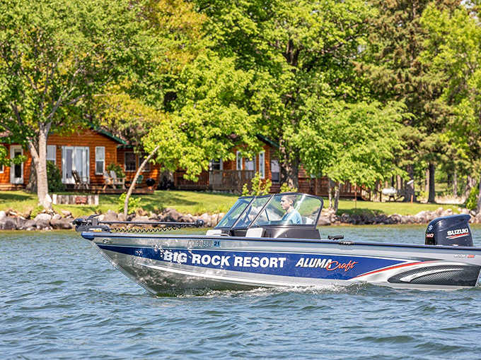 Not just any boat – an Alumacraft fishing vessel ready to deliver you to where the walleye are biting and the stories are born.