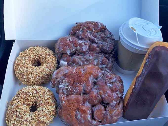 The dynamic duo of morning indulgence &ndash; massive apple fritters and steaming coffee, making Monday feel like Saturday since forever.