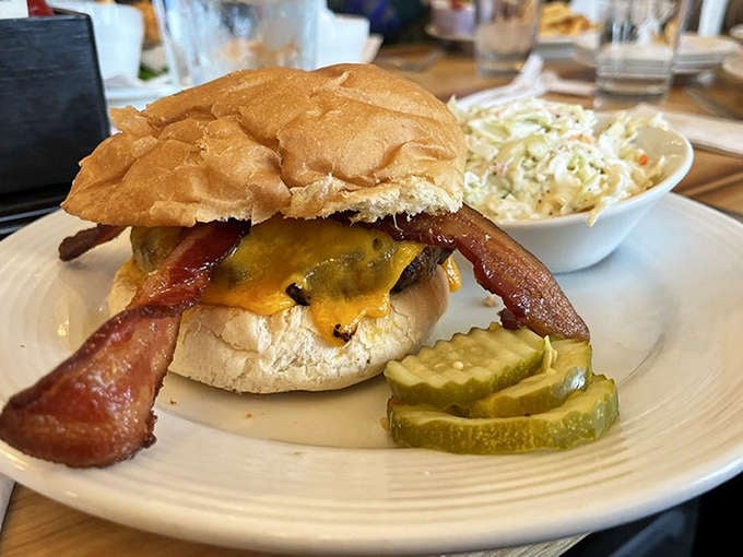The bacon cheeseburger arrives like a monument to proper burger construction &ndash; juicy patty, melty cheese, and bacon that means business.