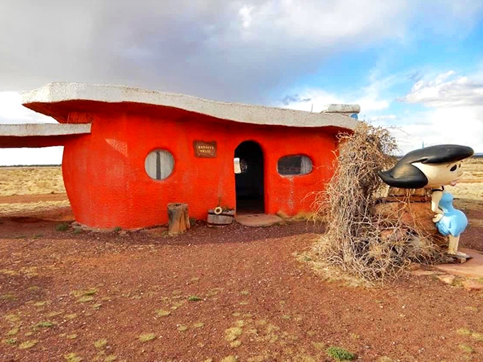 Barney Rubble's vibrant orange abode looks ready for a Stone Age housewarming party, circular windows and all.