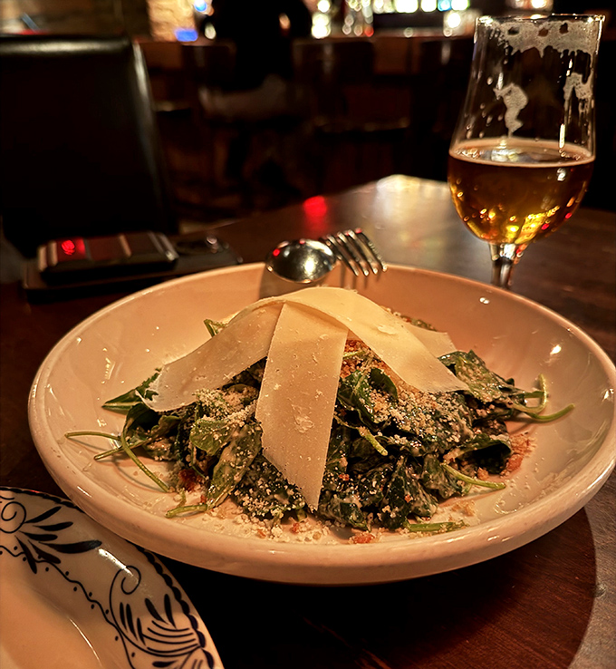 The black kale Caesar salad transforms healthy eating into an indulgence with shaved parmesan adding creamy richness to every crisp bite.