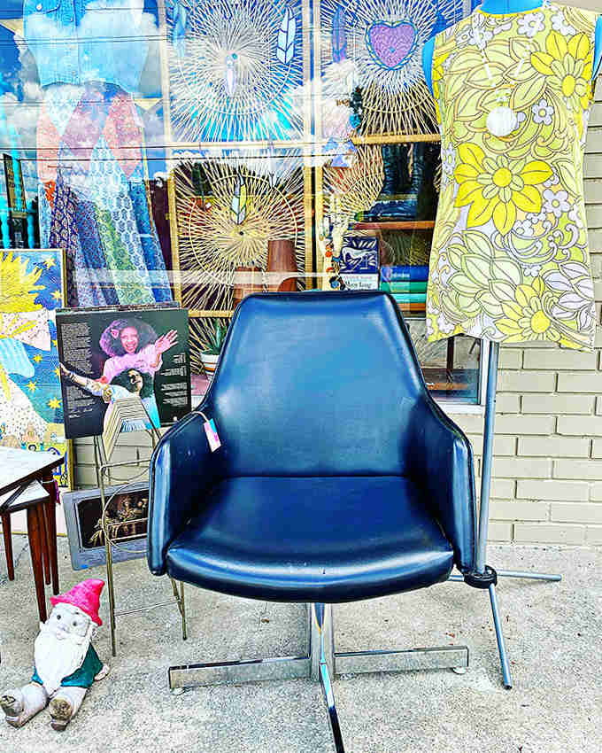 This sleek 1960s statement piece silently observes the shop's comings and goings, a throne for the vintage-curious shopper.