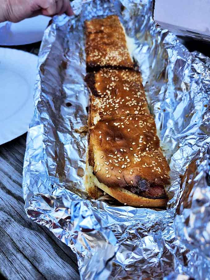 The bologna and cheese sub, wrapped in foil and baked to melty perfection, demonstrates why simple ingredients done right become extraordinary.