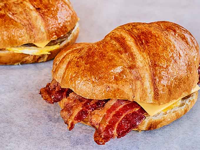 Buttery, flaky layers cradle eggs, cheese and bacon in a handheld masterpiece of morning engineering.