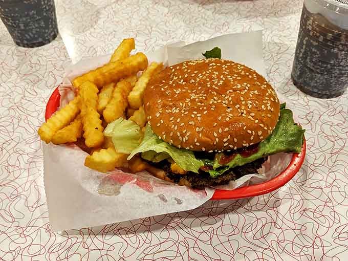That sesame seed bun cradles a grass-fed beef patty that would make any burger purist nod with approval and reach for napkins.