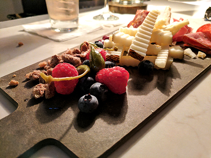 Charcuterie Board: A jury of culinary peers &ndash; cheeses, meats, and berries arranged so beautifully you'll hesitate before disturbing the evidence.