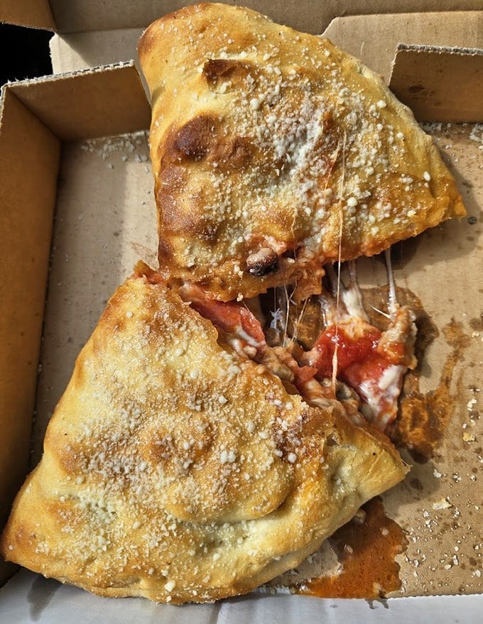 The Pizza Pouch: where cheese performs its most impressive magic trick &ndash; disappearing before your eyes while simultaneously expanding your waistline.